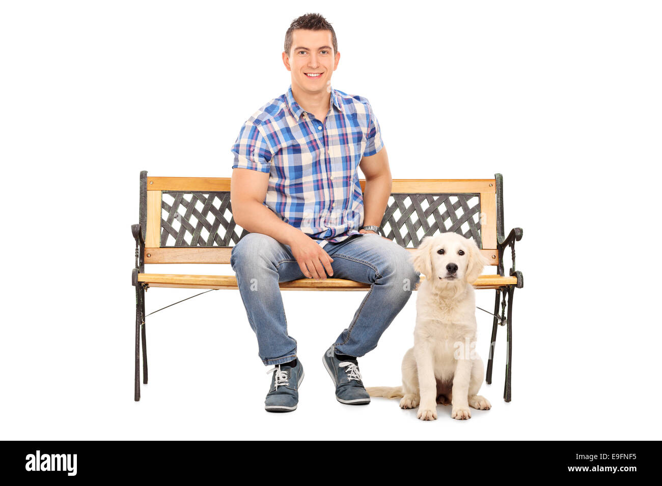 Man sitting on a bench with a cute puppy isolated on white background ...