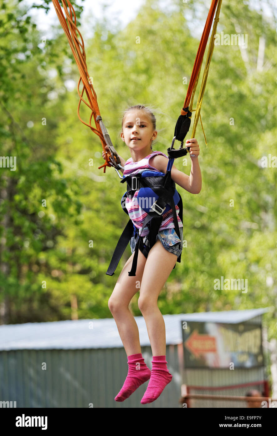 Jumping on a trampoline Stock Photo - Alamy
