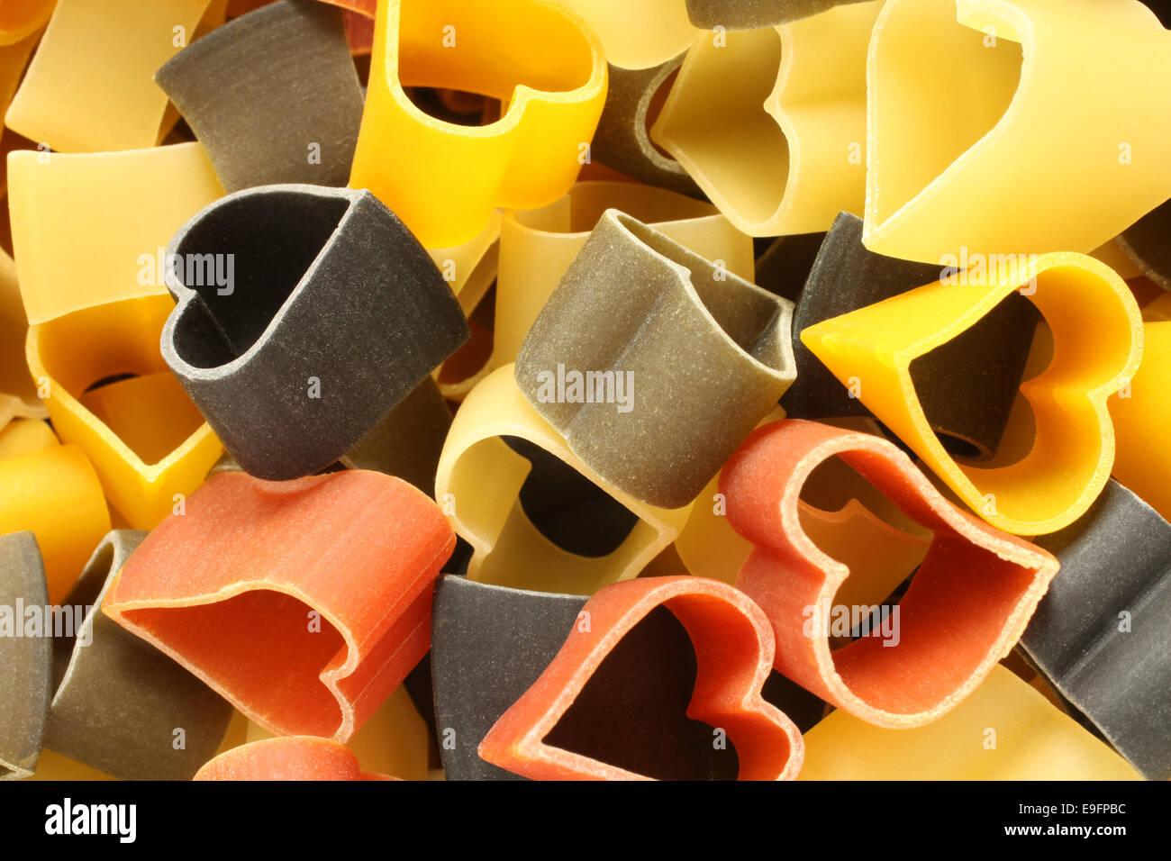 Heart-shaped colored Italian pasta Stock Photo - Alamy