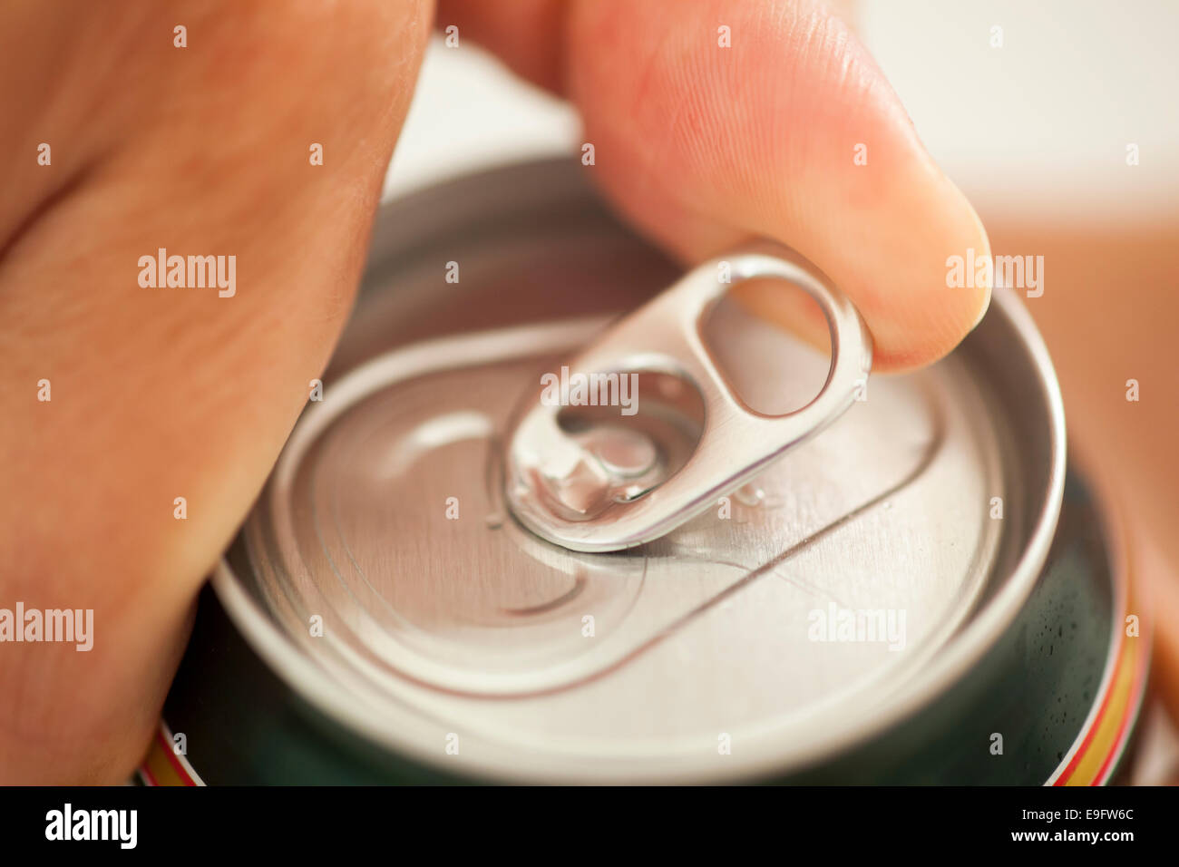Hand opening drink can. Shallow depth of field Stock Photo - Alamy