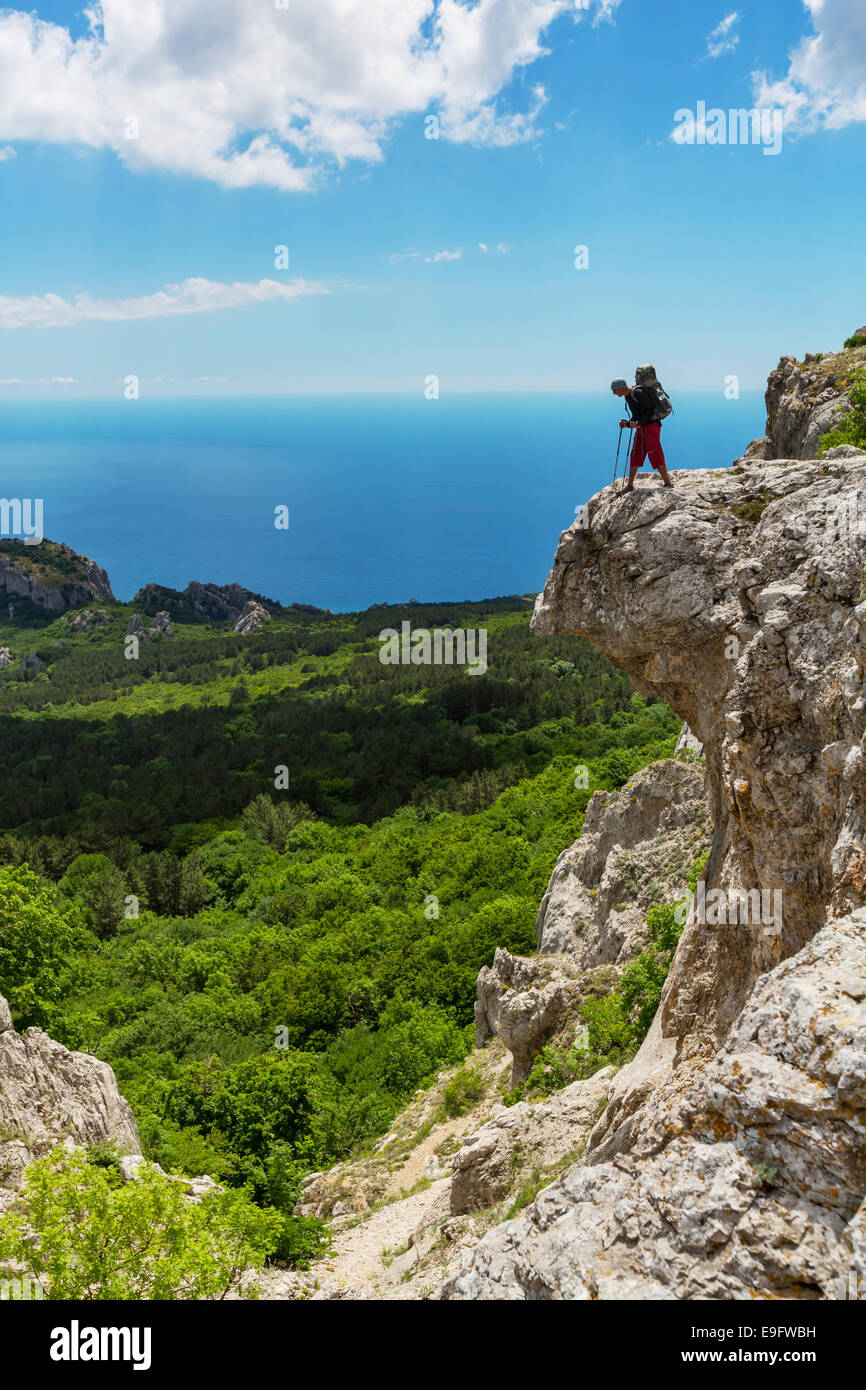 Man on the cliff Stock Photo - Alamy