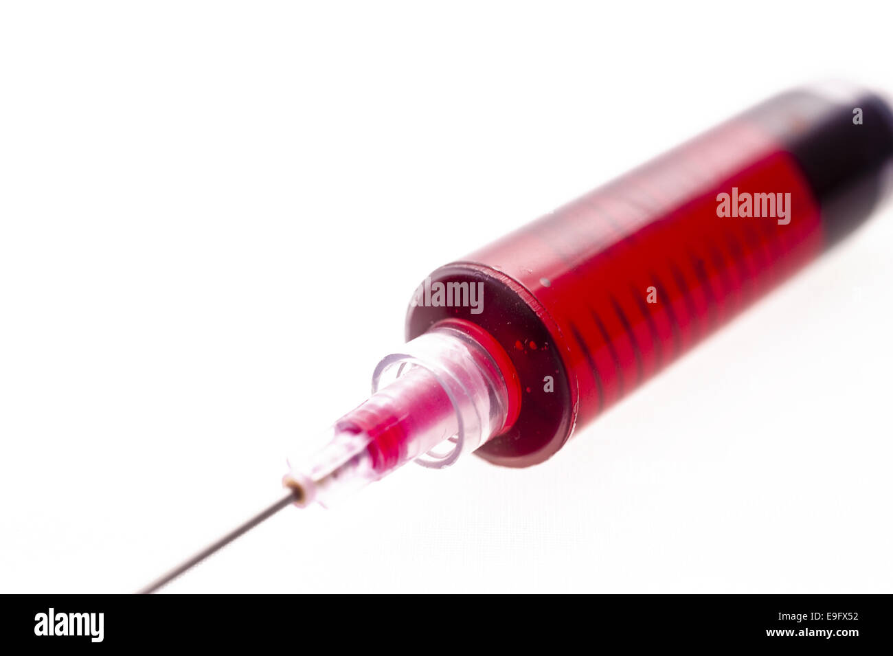 Syringe with red injection Cut Out Stock Images & Pictures - Alamy
