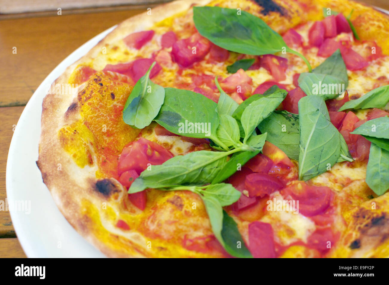 Pizza with Basil Stock Photo - Alamy