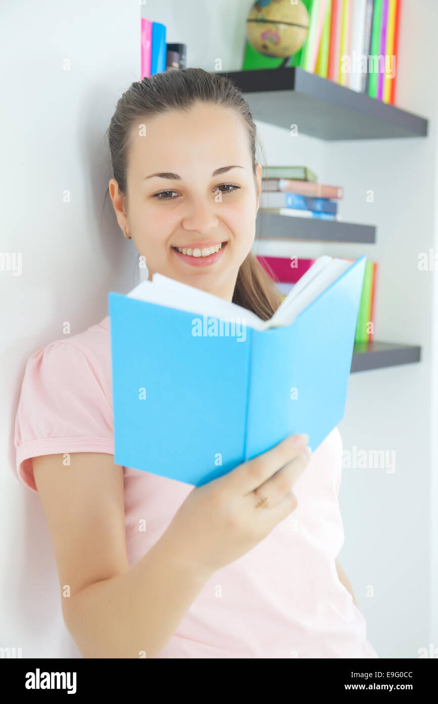 Young attractive lady with a book Stock Photo - Alamy
