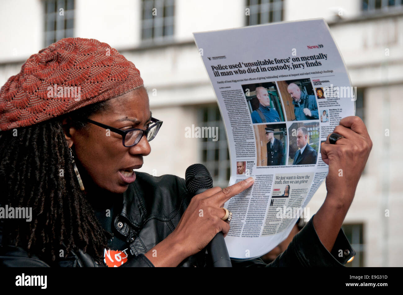 Marcia Rigg holding up article about police who used Unsuitable force ...