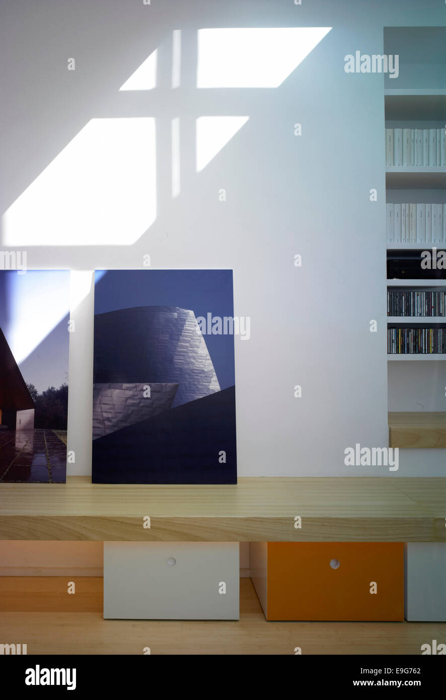 Minimal white-walled interior with wooden bench and storage Stock Photo ...