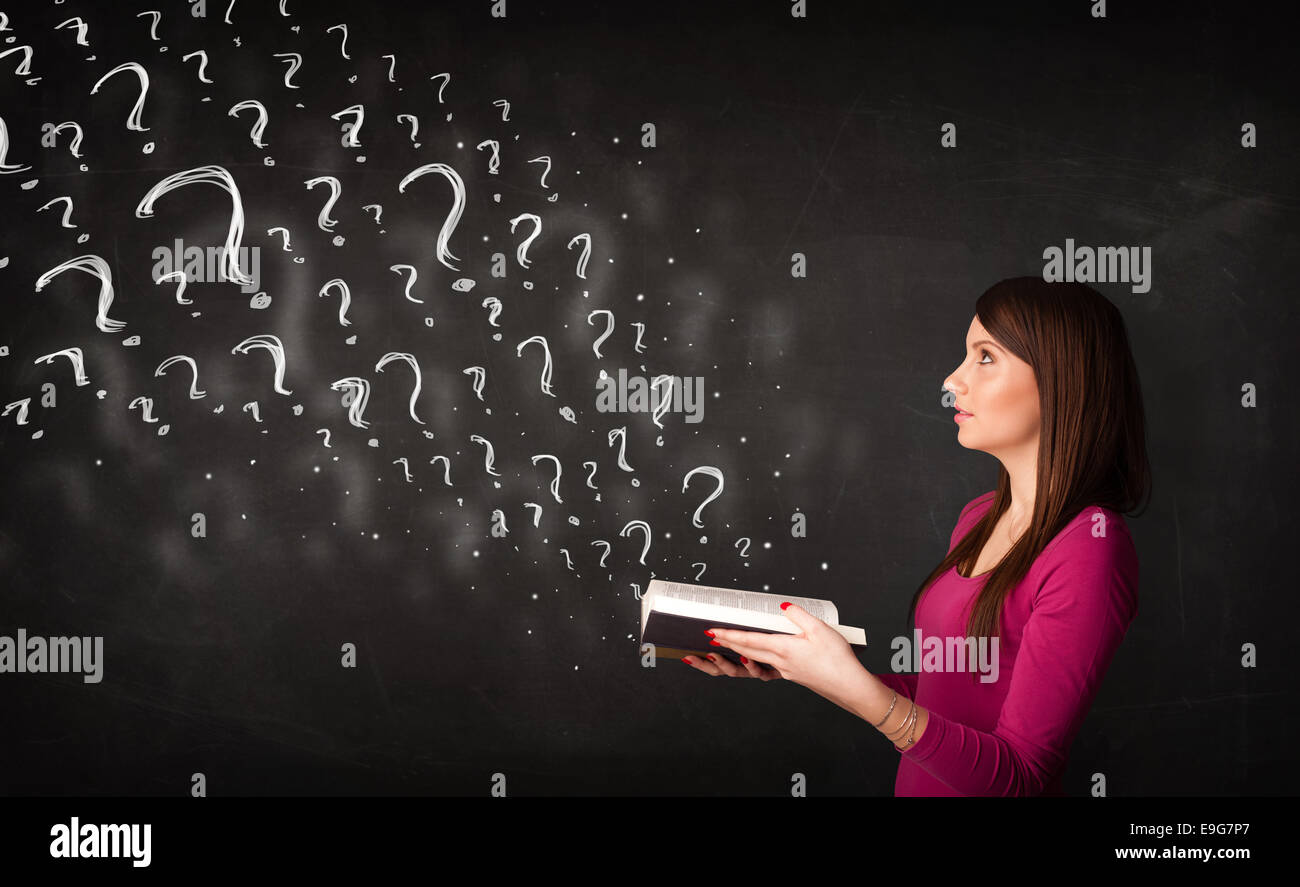 Pretty woman reading a book with question marks coming out from it ...