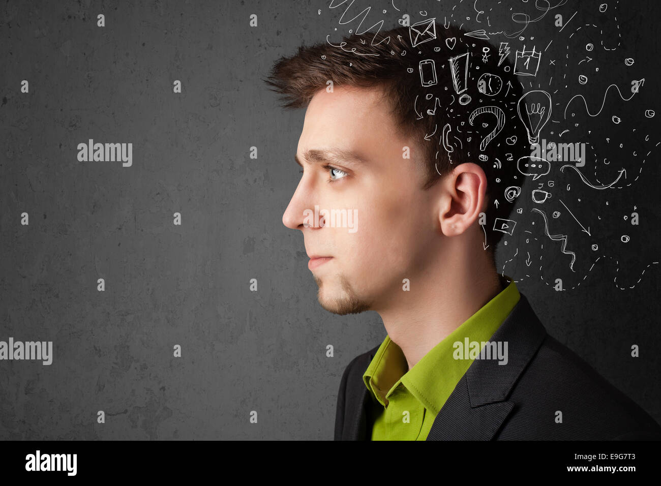 Young man thinking with abstract lines and symbols Stock Photo - Alamy