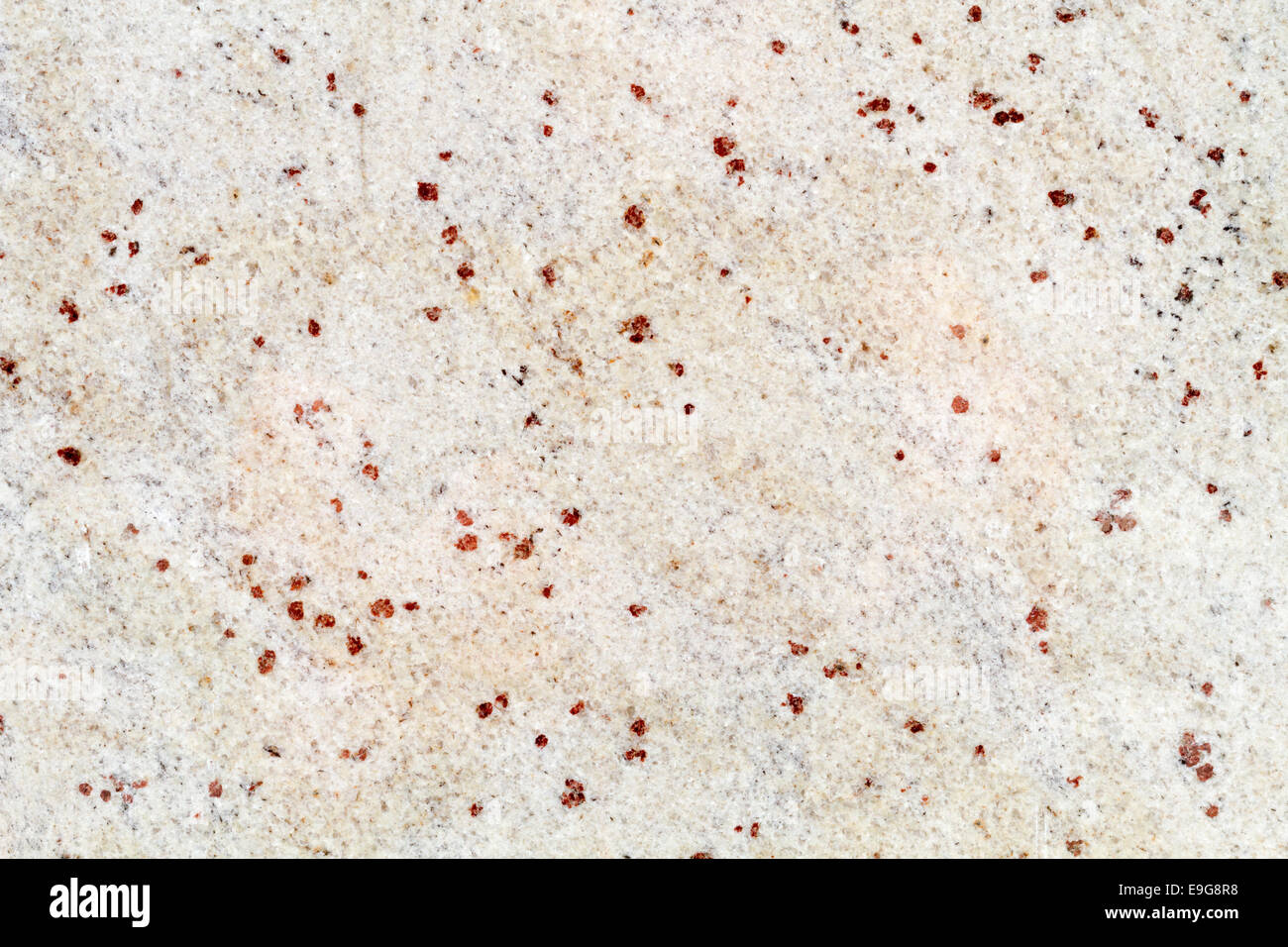 Yellow granite structure with red dots Stock Photo - Alamy