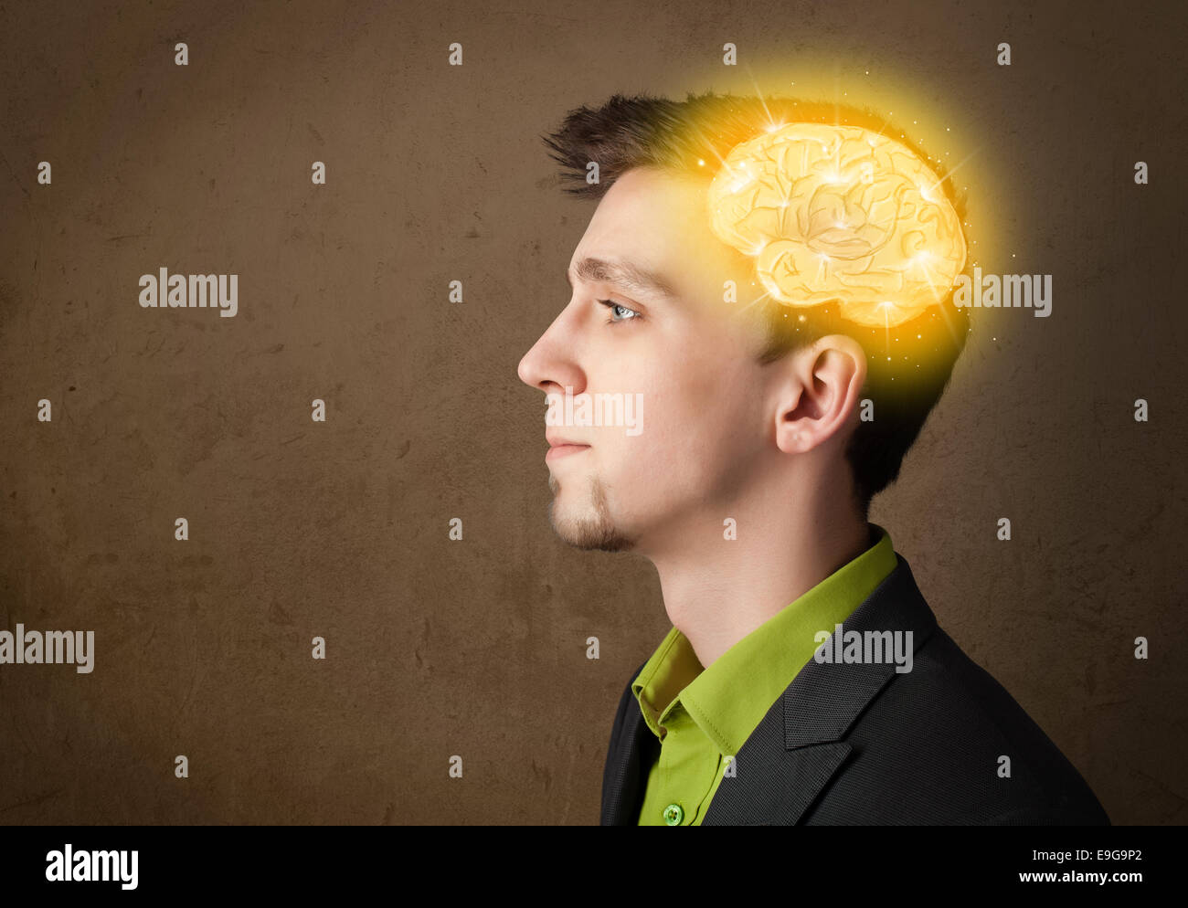Young man thinking with glowing brain illustration Stock Photo - Alamy