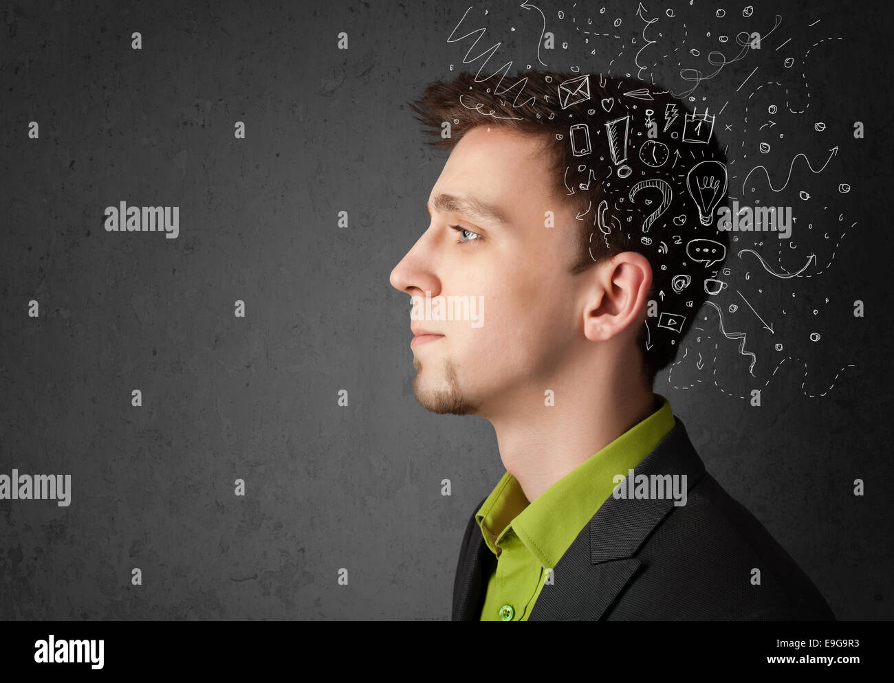 Young man thinking with abstract lines and symbols Stock Photo - Alamy