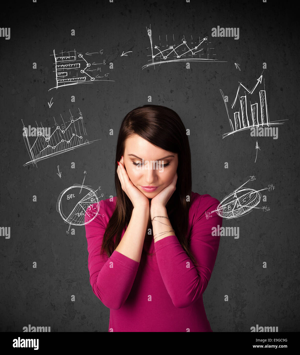 Young woman thinking with charts circulation around her head Stock ...