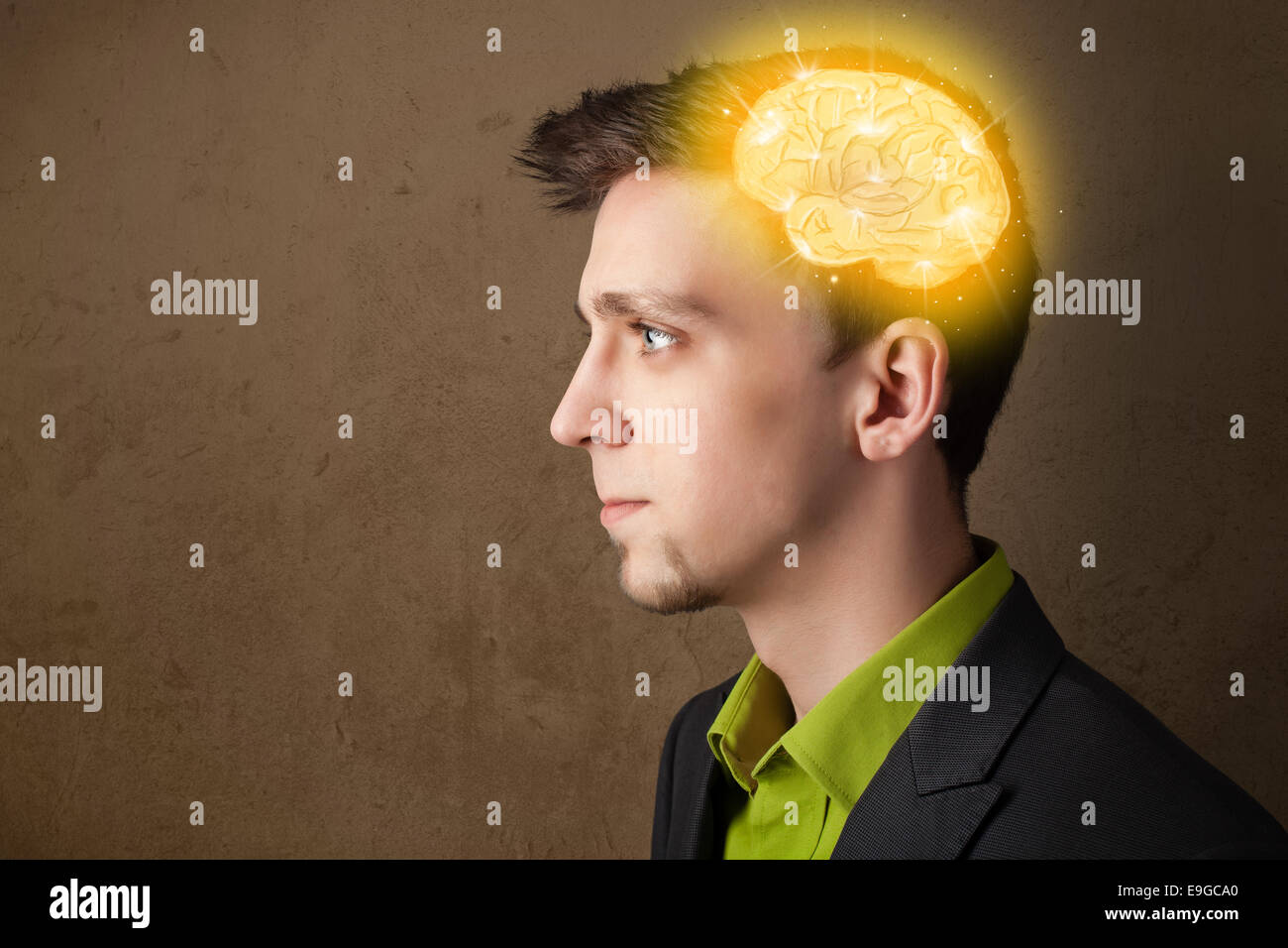 Young man thinking with glowing brain illustration Stock Photo - Alamy