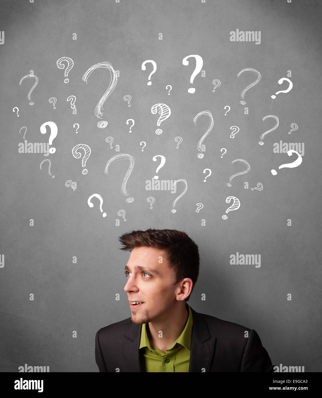 Businessman with question marks above his head Stock Photo - Alamy