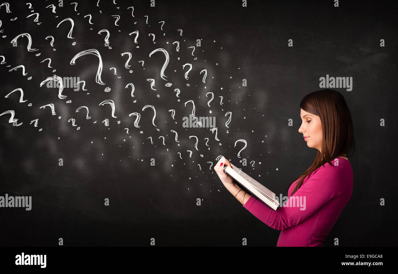 Pretty woman reading a book with question marks coming out from it ...