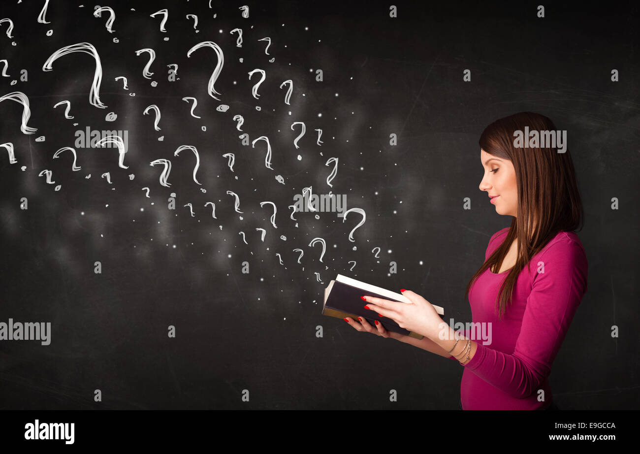 Pretty woman reading a book with question marks coming out from it ...