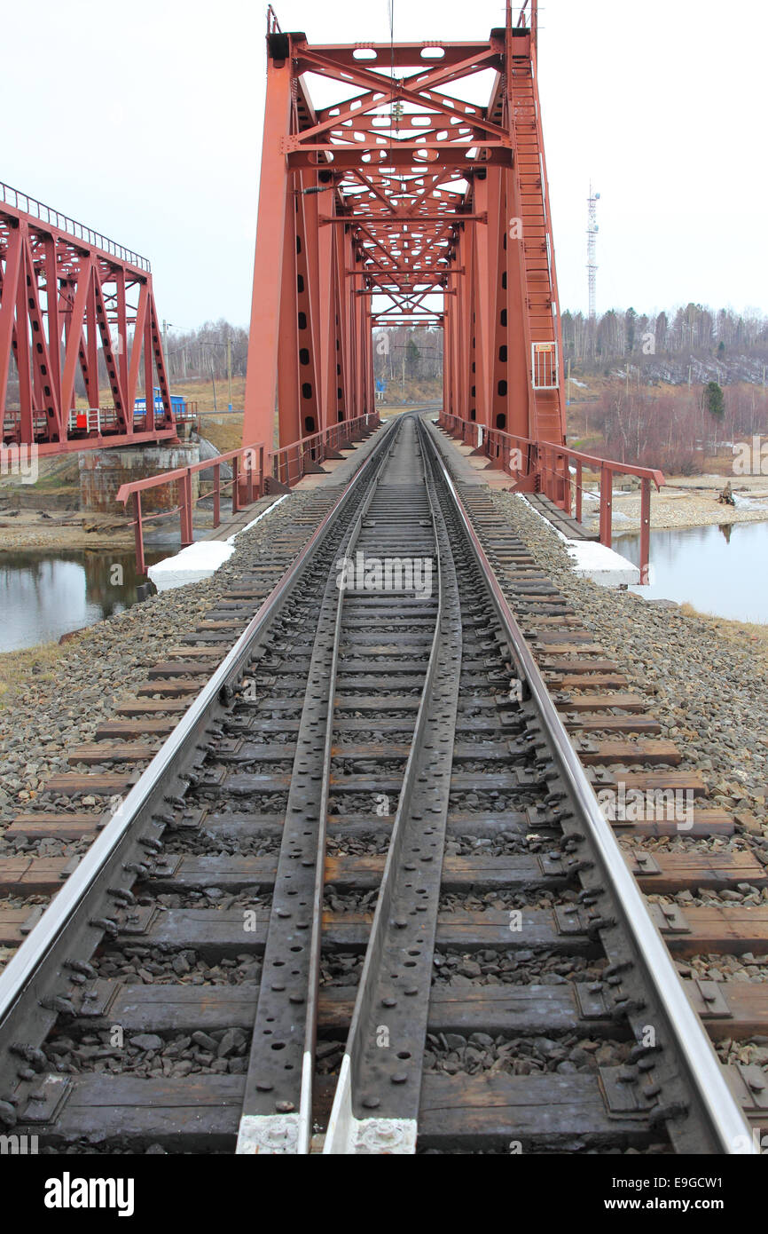 Red metal railway bridge across the river Stock Photo - Alamy