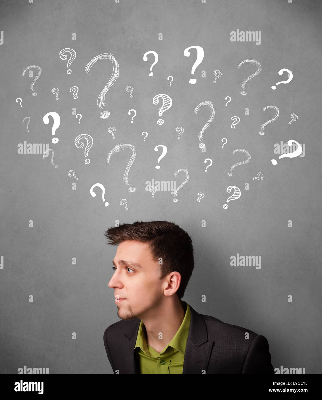 Businessman with question marks above his head Stock Photo - Alamy