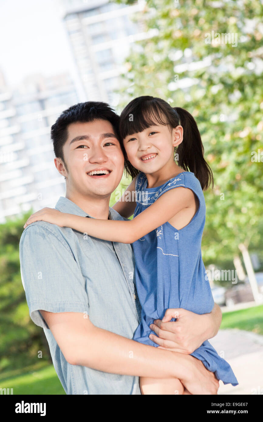 Happy young father and daughter looking at view Stock Photo - Alamy