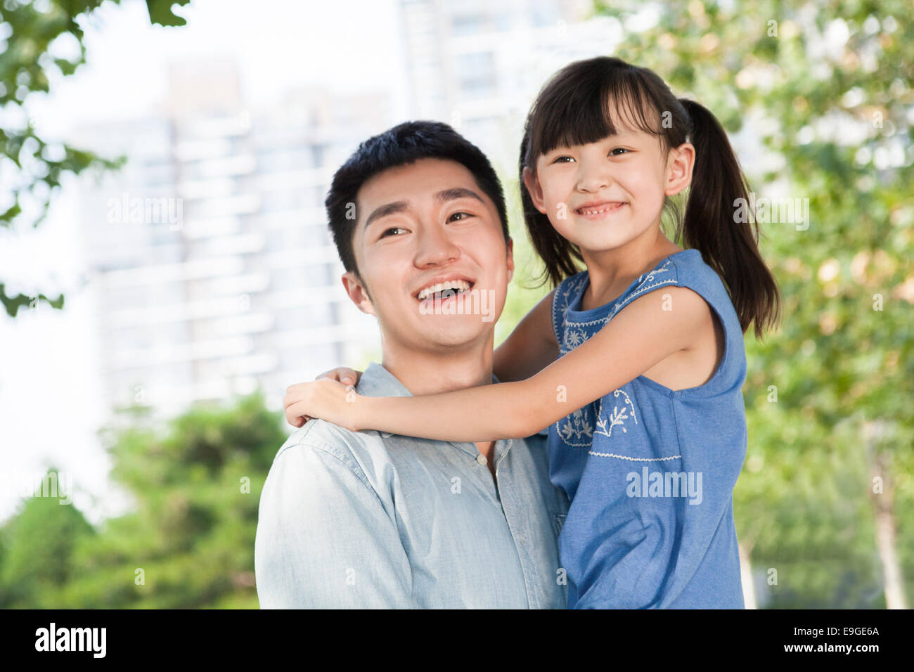 Happy young father and daughter looking at view Stock Photo - Alamy