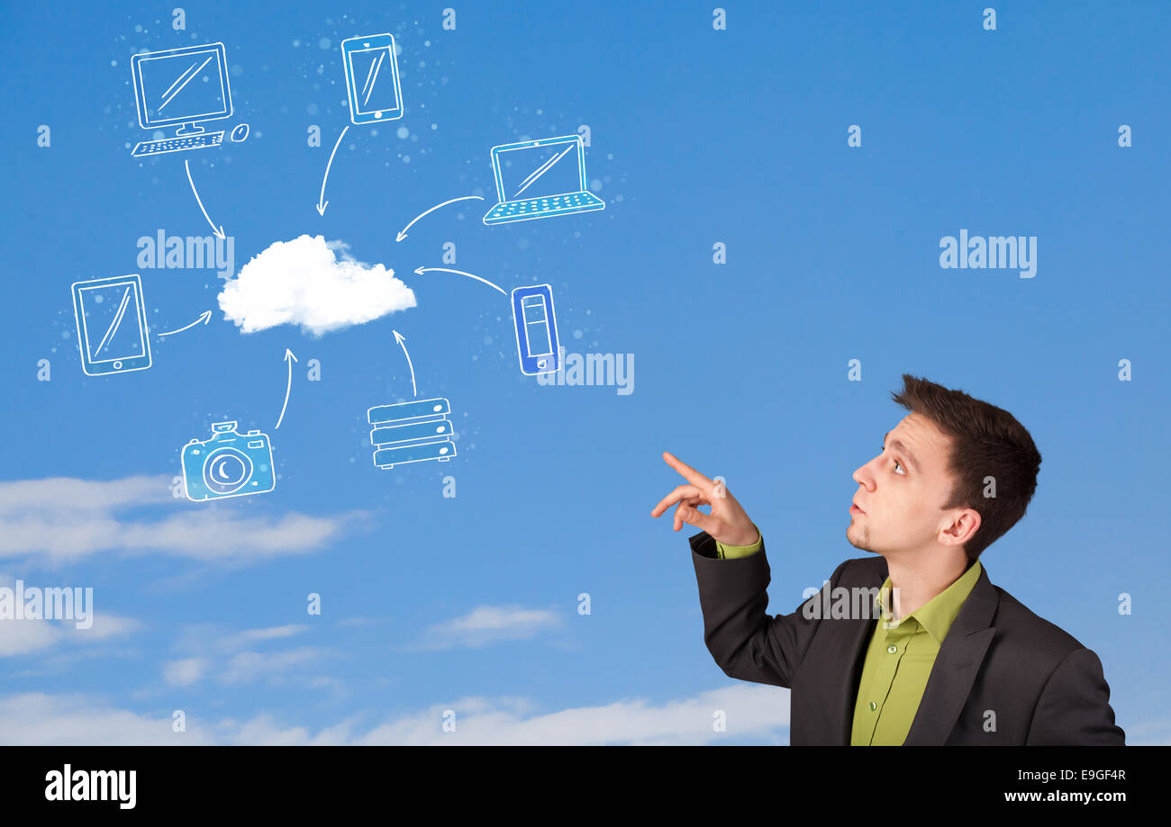 Handsome man looking at cloud computing concept on blue sky Stock Photo ...