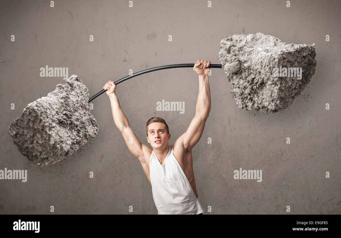 muscular man lifting large rock stone weights Stock Photo - Alamy