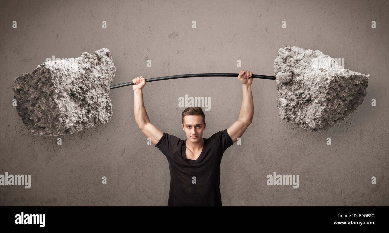 muscular man lifting large rock stone weights Stock Photo - Alamy
