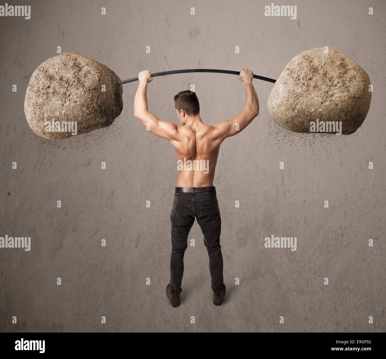 muscular man lifting large rock stone weights Stock Photo - Alamy