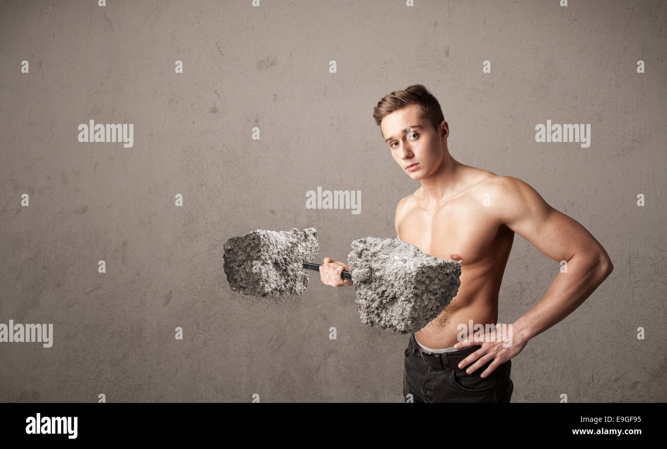 muscular man lifting large rock stone weights Stock Photo - Alamy