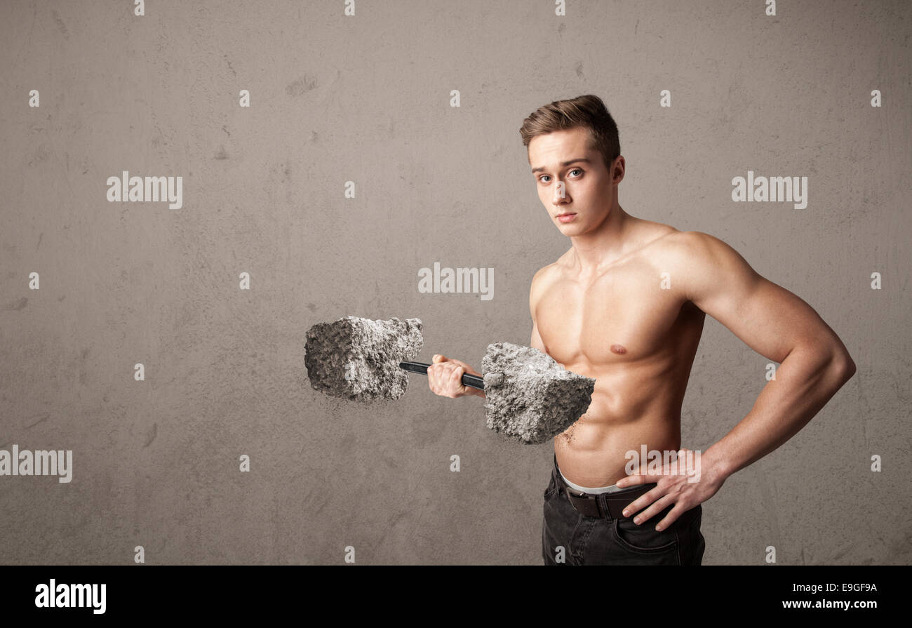muscular man lifting large rock stone weights Stock Photo - Alamy