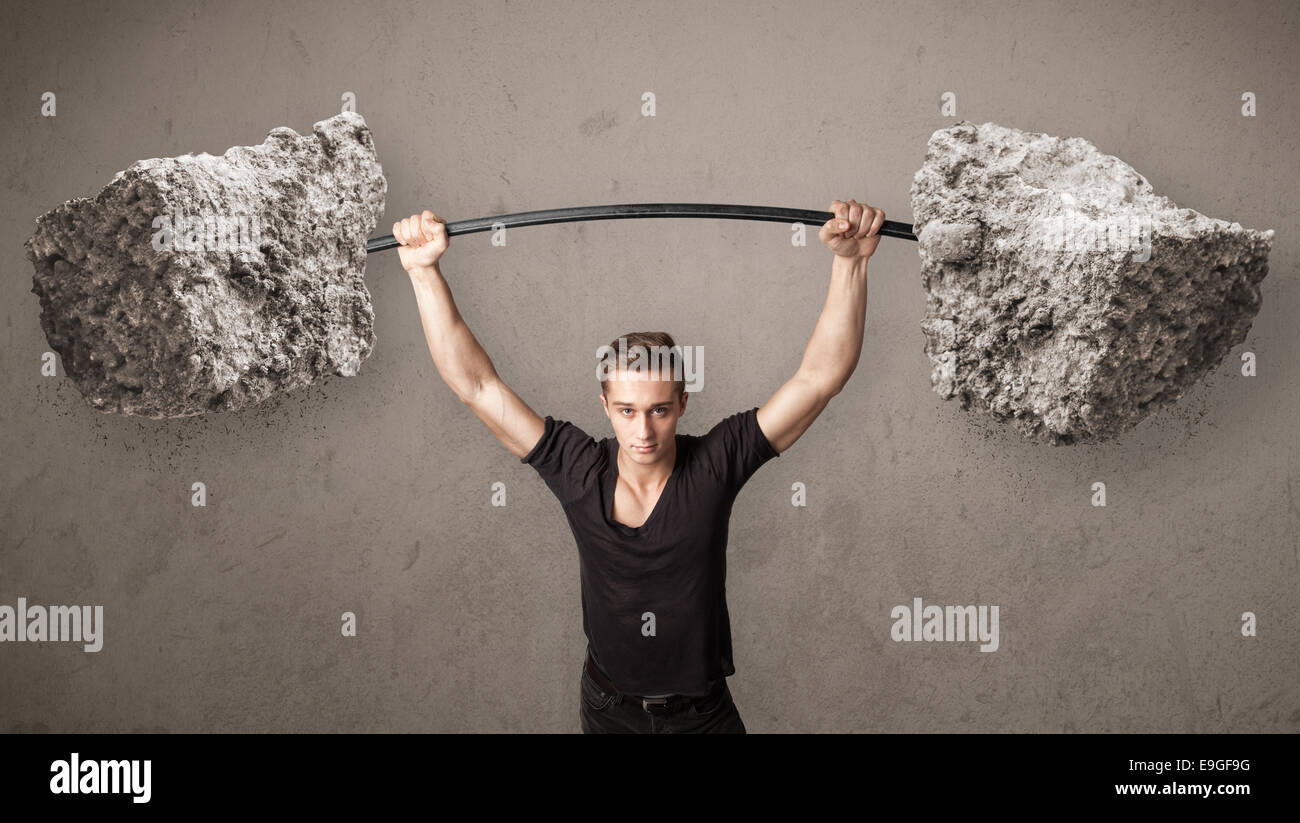 muscular man lifting large rock stone weights Stock Photo - Alamy