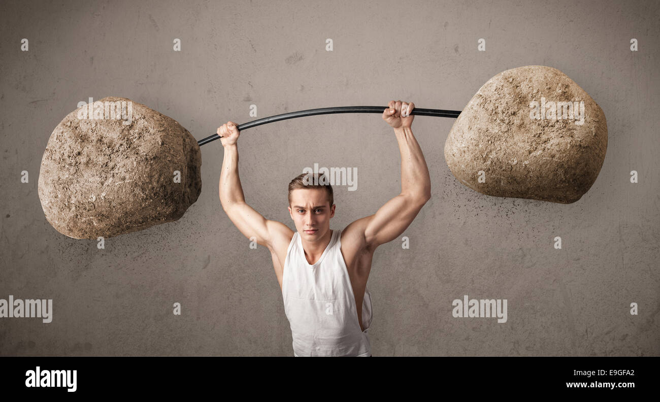 muscular man lifting large rock stone weights Stock Photo - Alamy