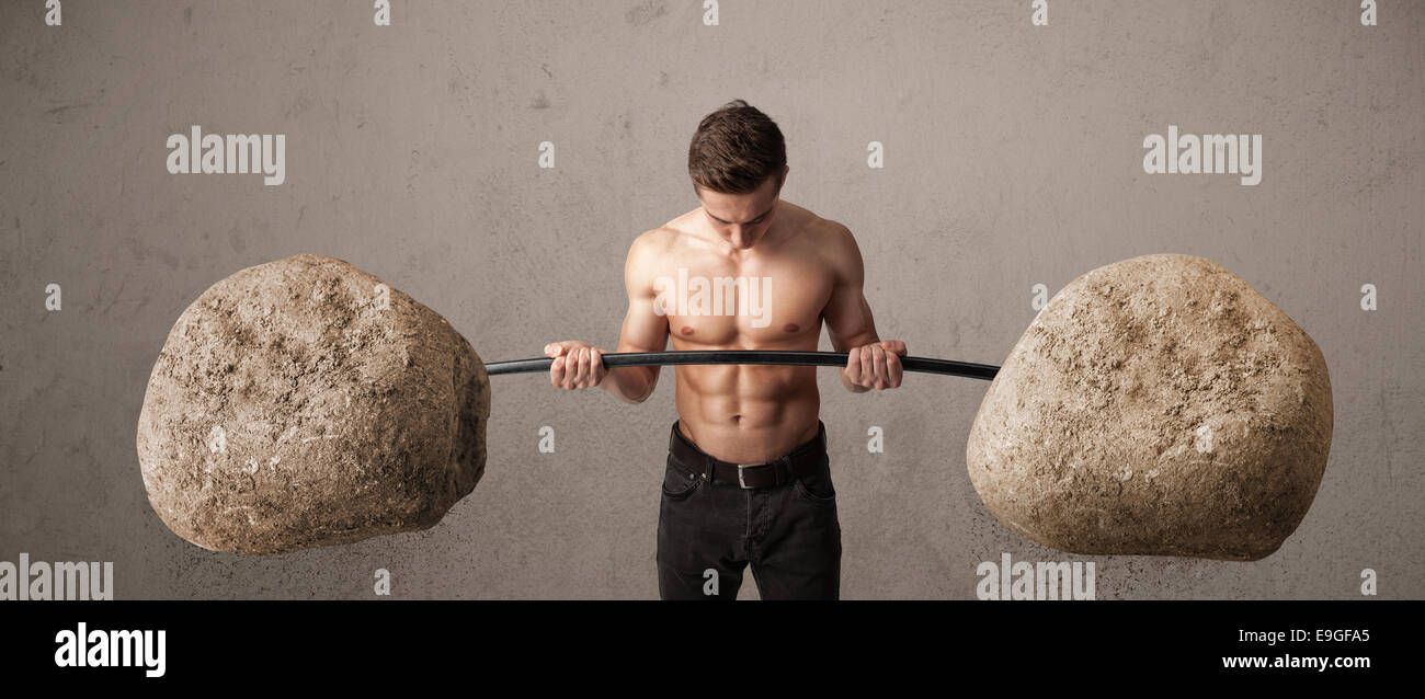 muscular man lifting large rock stone weights Stock Photo - Alamy