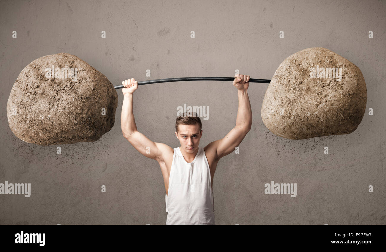 muscular man lifting large rock stone weights Stock Photo - Alamy