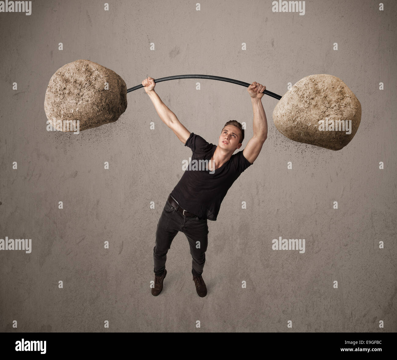 muscular man lifting large rock stone weights Stock Photo - Alamy