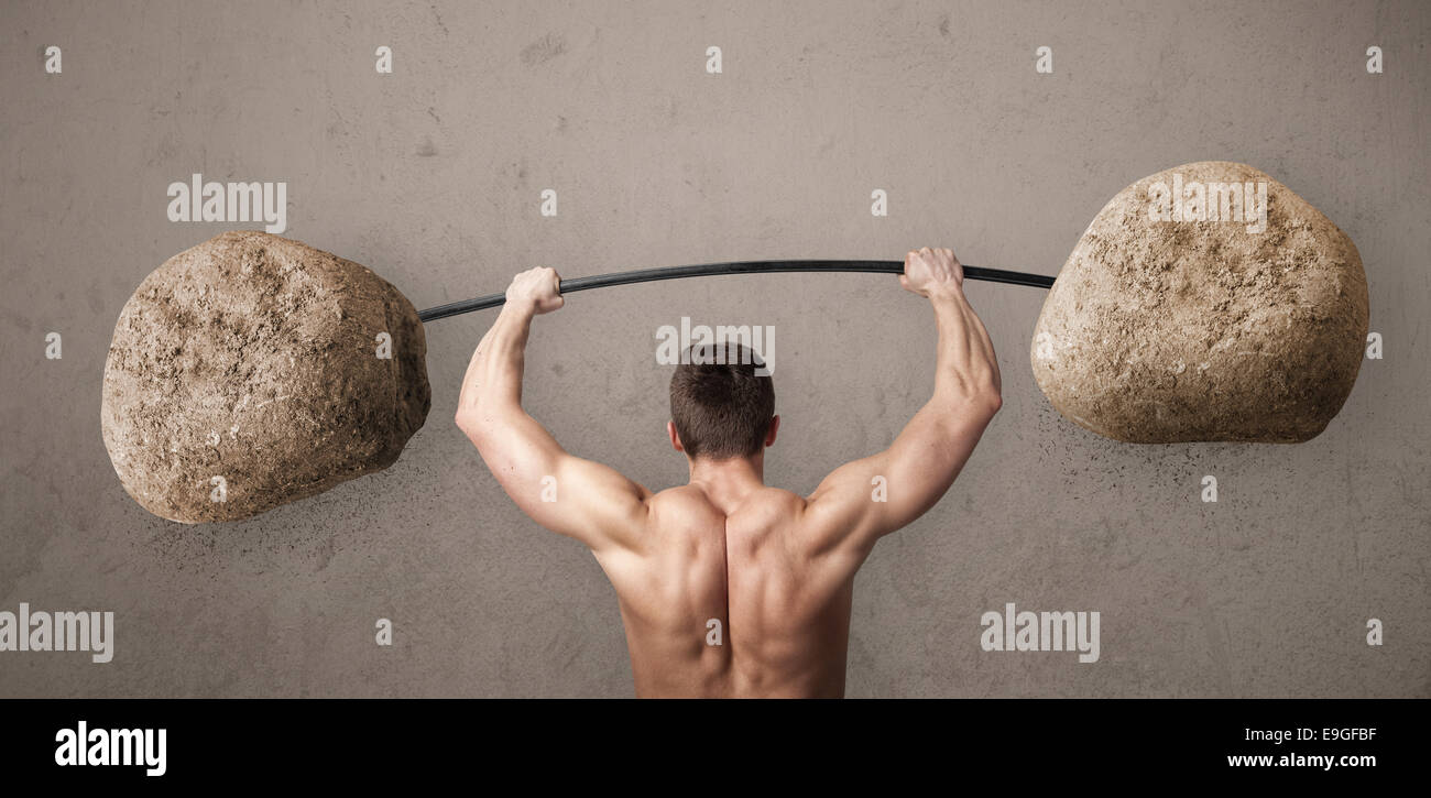 muscular man lifting large rock stone weights Stock Photo - Alamy