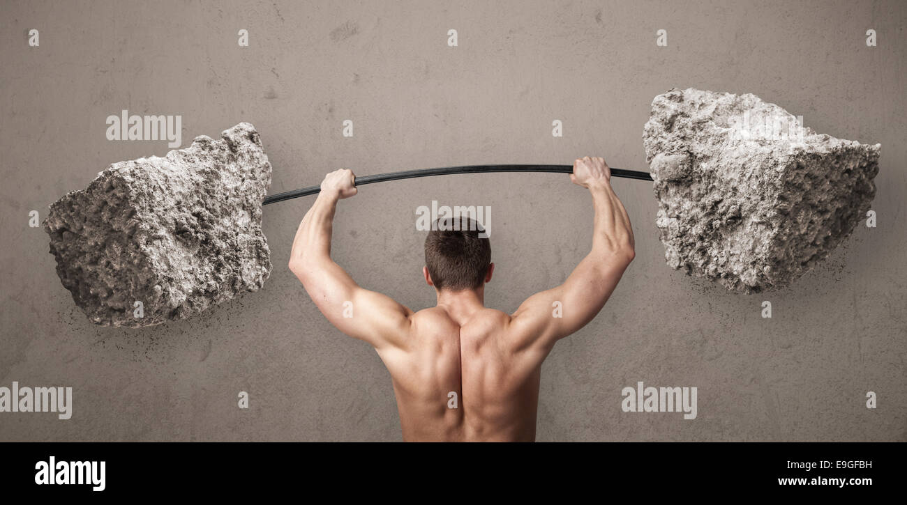 muscular man lifting large rock stone weights Stock Photo - Alamy