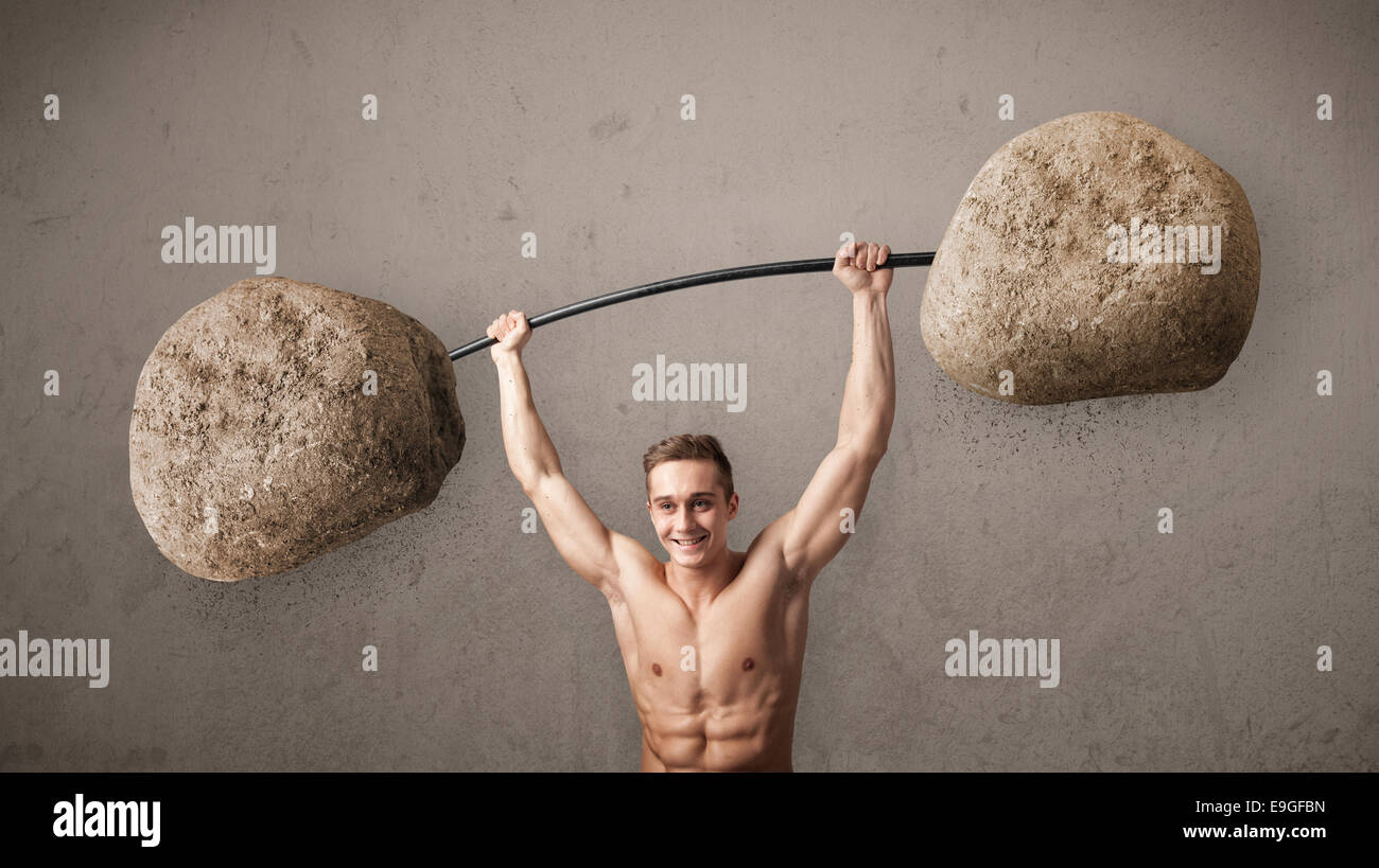 muscular man lifting large rock stone weights Stock Photo - Alamy