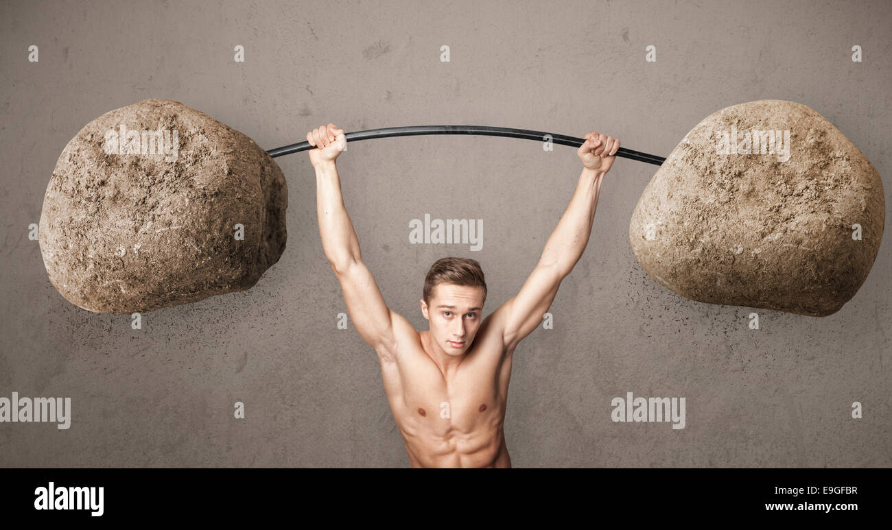 muscular man lifting large rock stone weights Stock Photo - Alamy