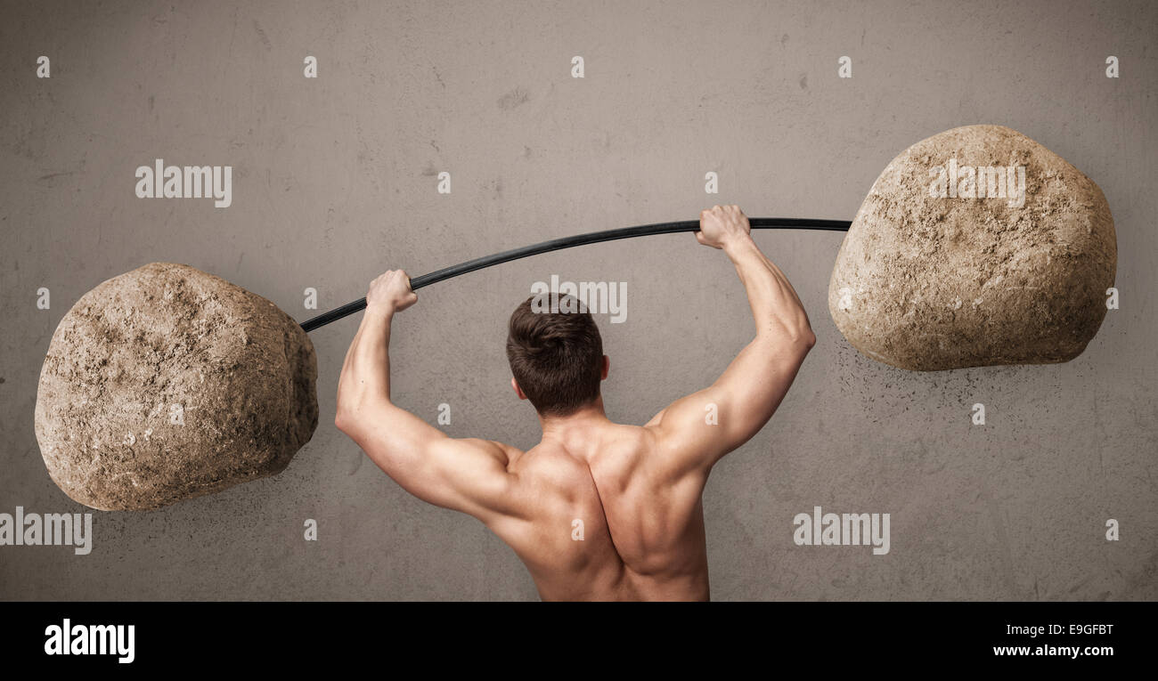 muscular man lifting large rock stone weights Stock Photo - Alamy