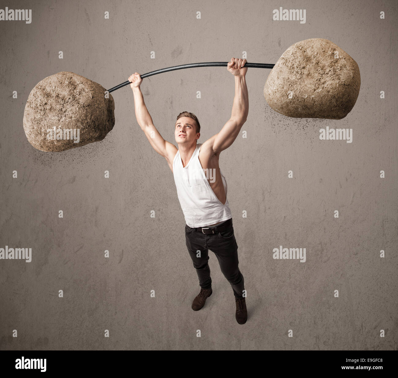 muscular man lifting large rock stone weights Stock Photo - Alamy