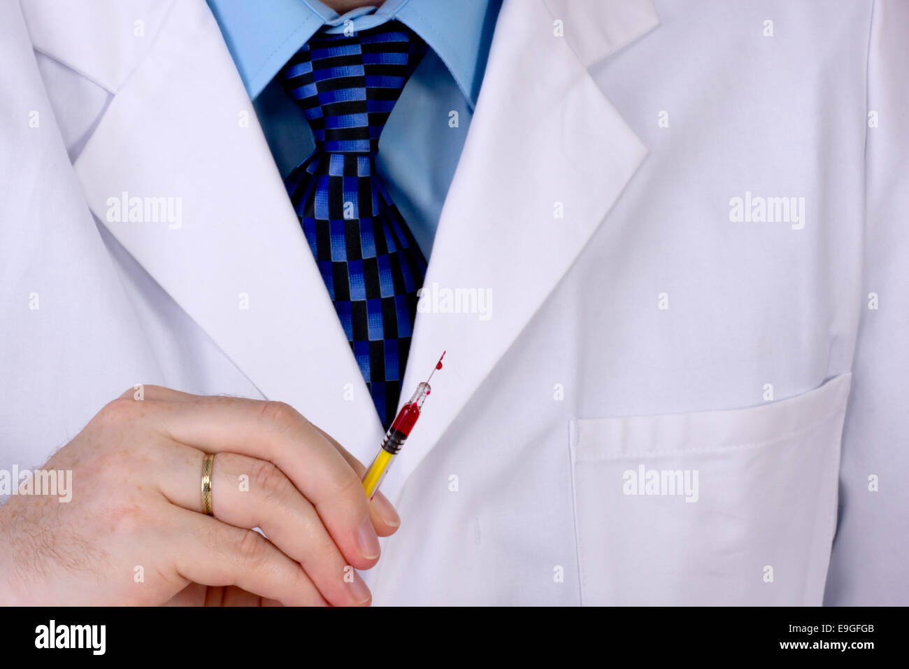 Scientist holding injection hi-res stock photography and images - Alamy