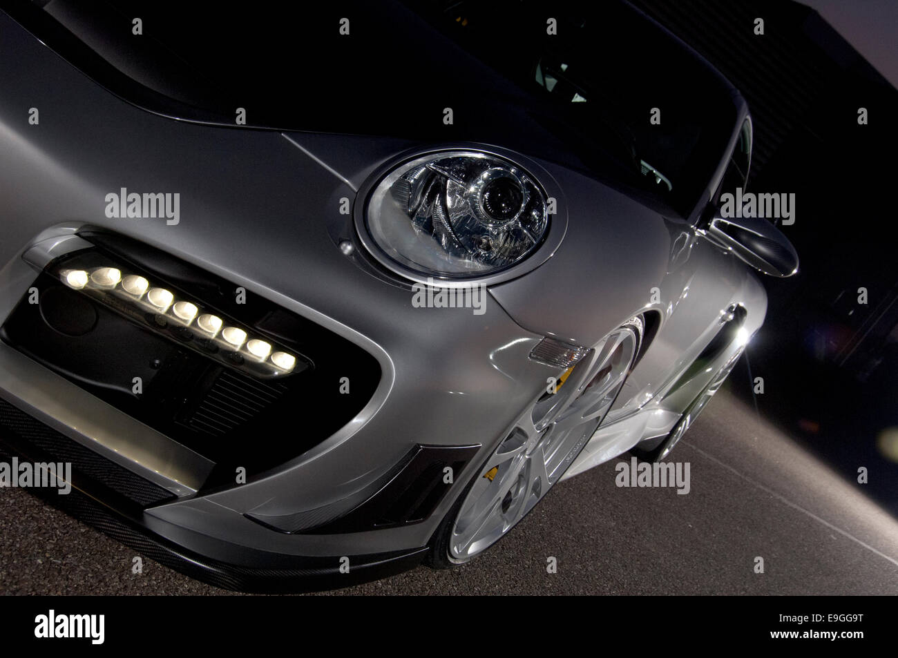 Car headlight and side picked out by light Stock Photo - Alamy