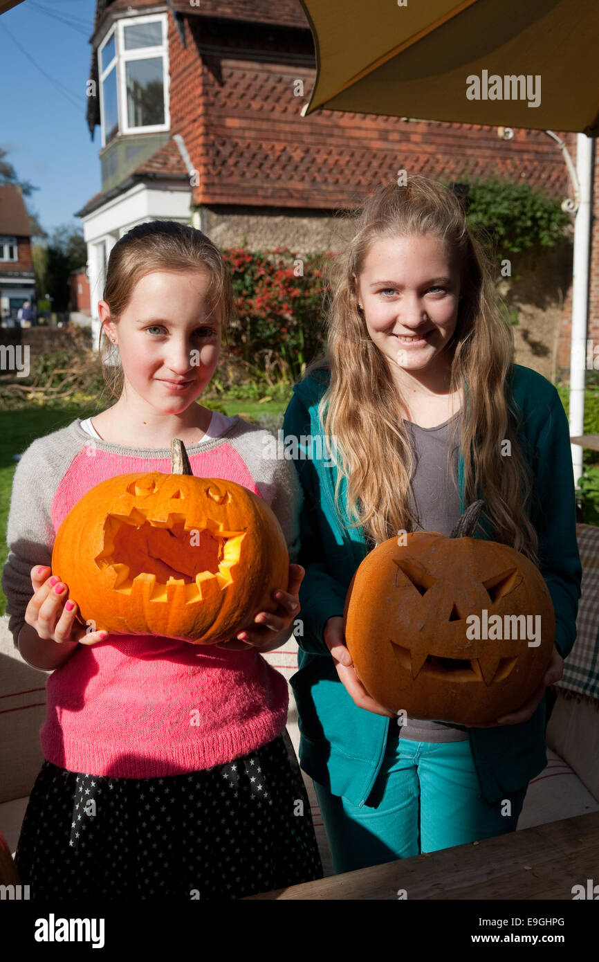 Half term fun, Two girls pose with their finished pumpkin ready for ...