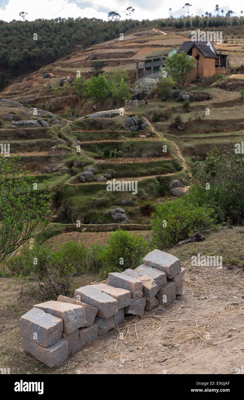 Hand-hewn granite building blocks on a road in Madagascar Stock Photo ...