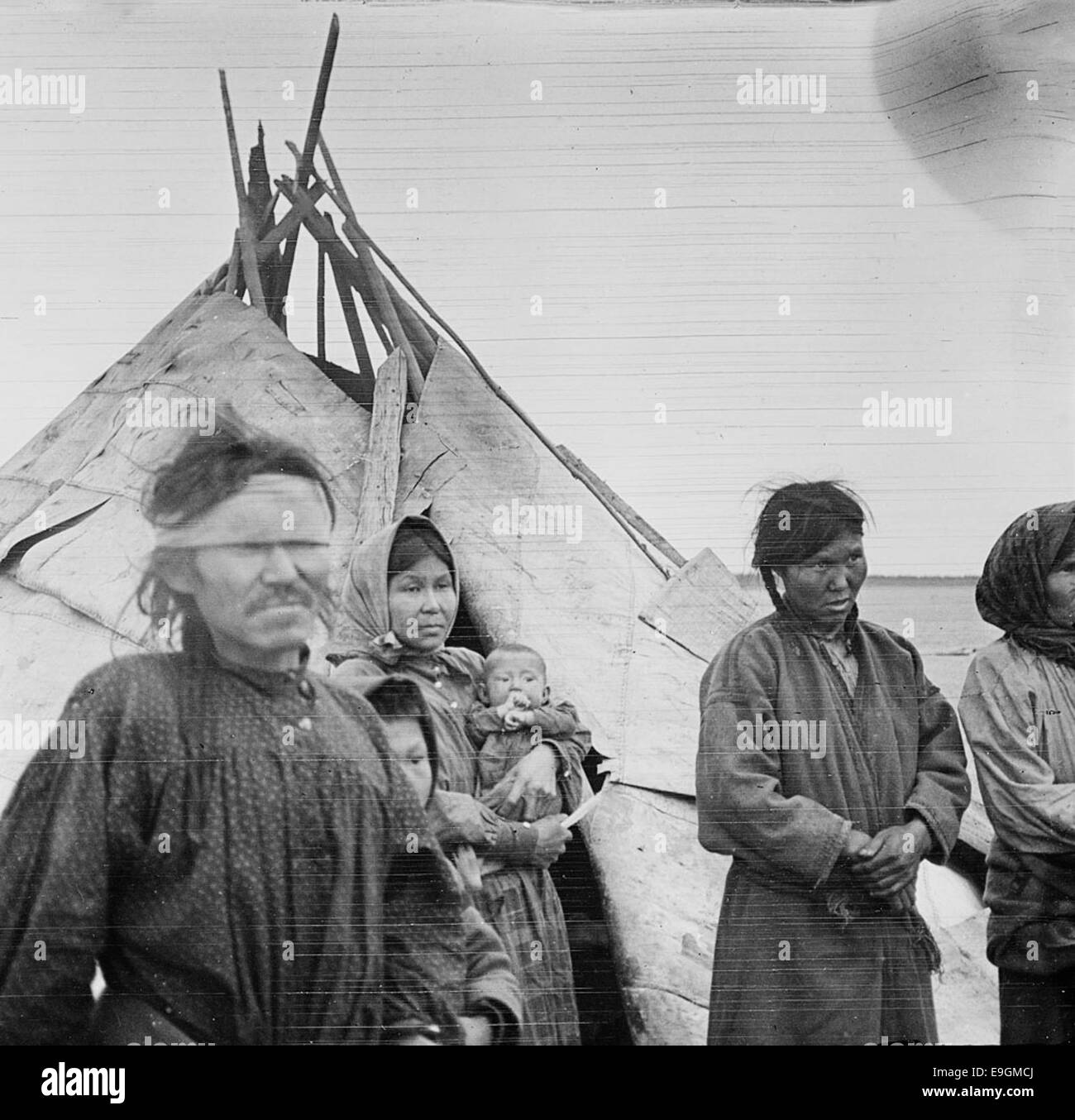 A photograph of the Evenki people in Russia, with the group standing in ...