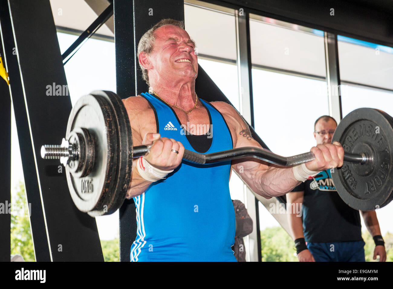 Male participant performing the strict curl Stock Photo - Alamy