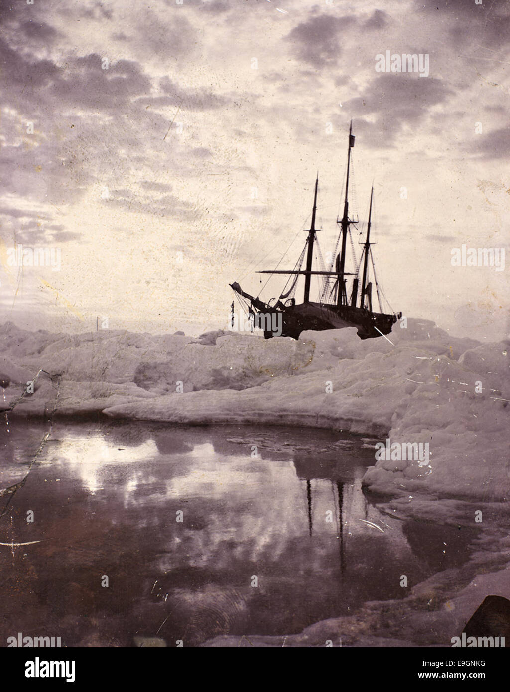 The photograph shows the *Fram* ship trapped in the ice during its ...