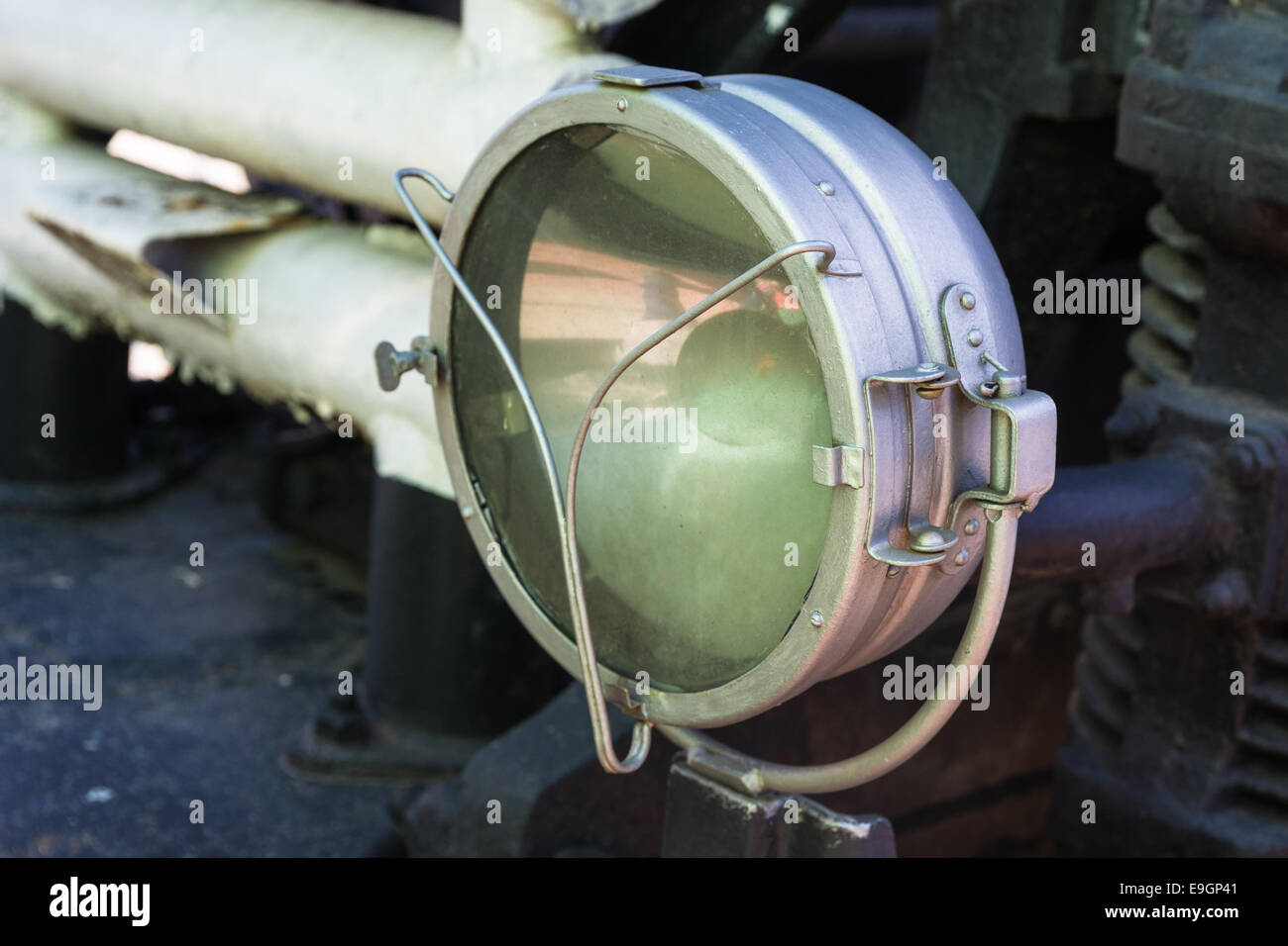 Weathered electrical headlight of a steam locomotive. Electrical bulb ...