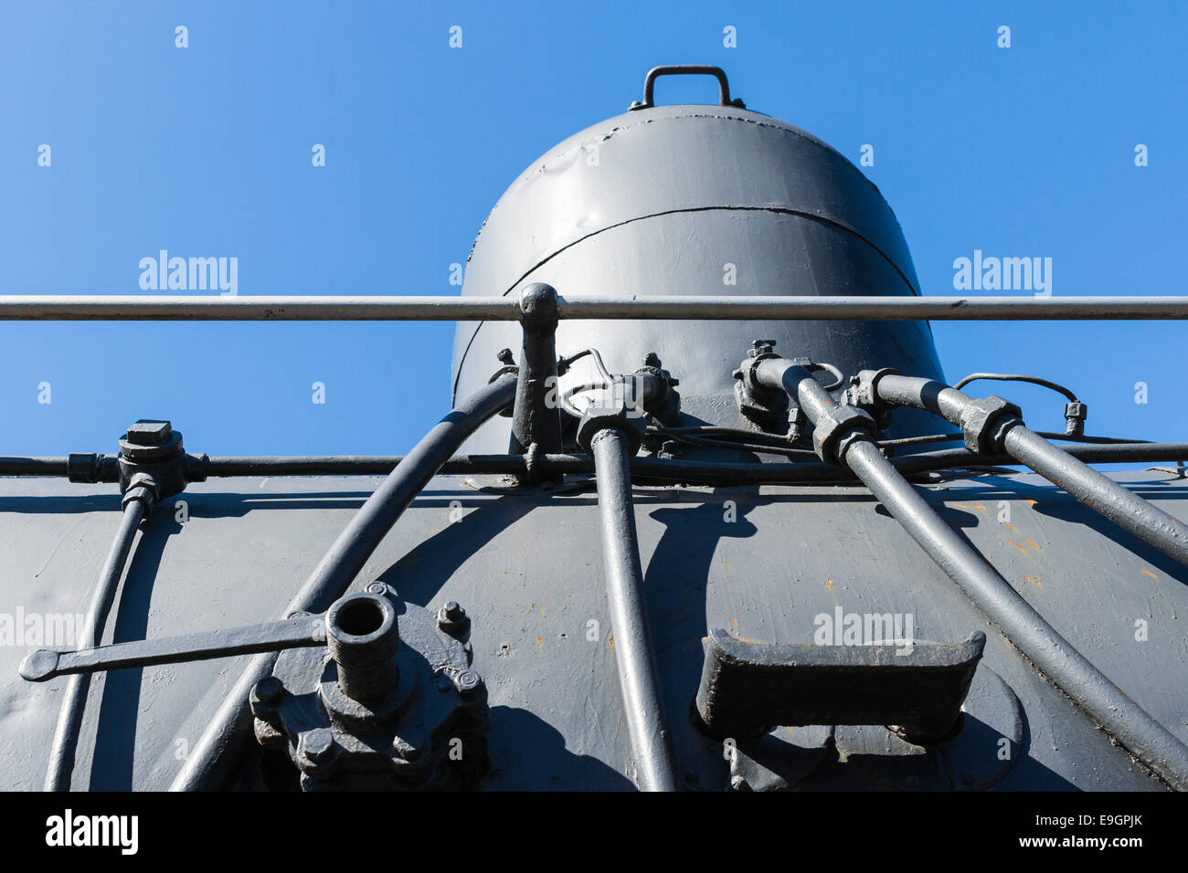 Closeup view of a sand dome on top of steam locomotive boiler against ...